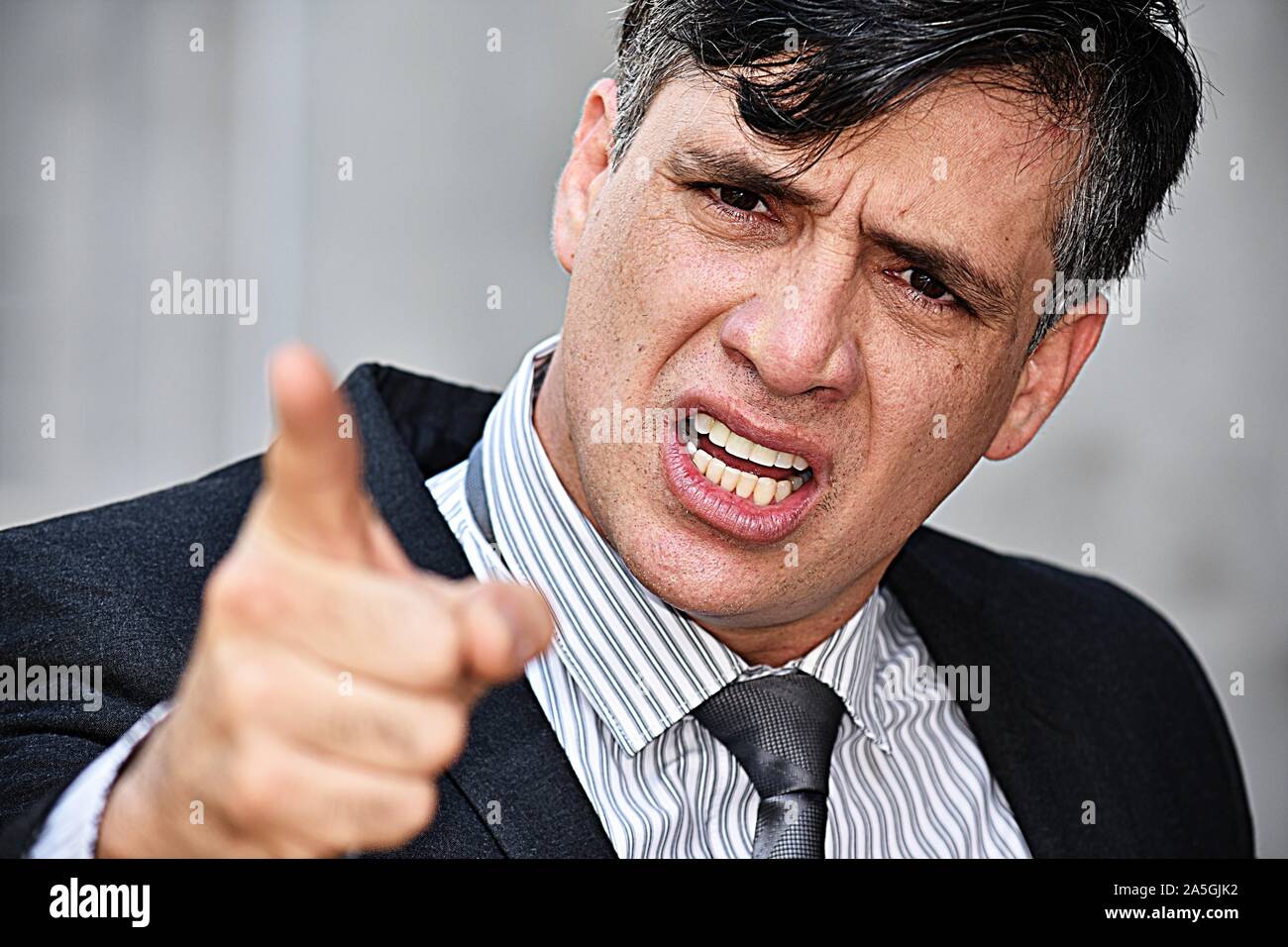 Entrepreneur And Anger Wearing Suit And Tie Stock Photo - Alamy