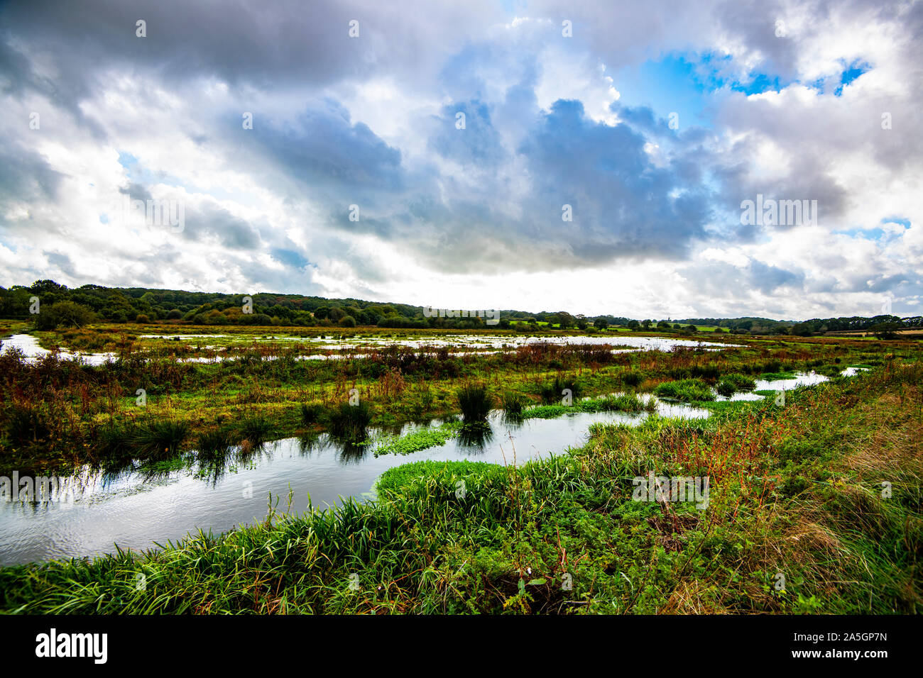 The winter-flooded valley of the Combe Haven river near Bexhill in East ...