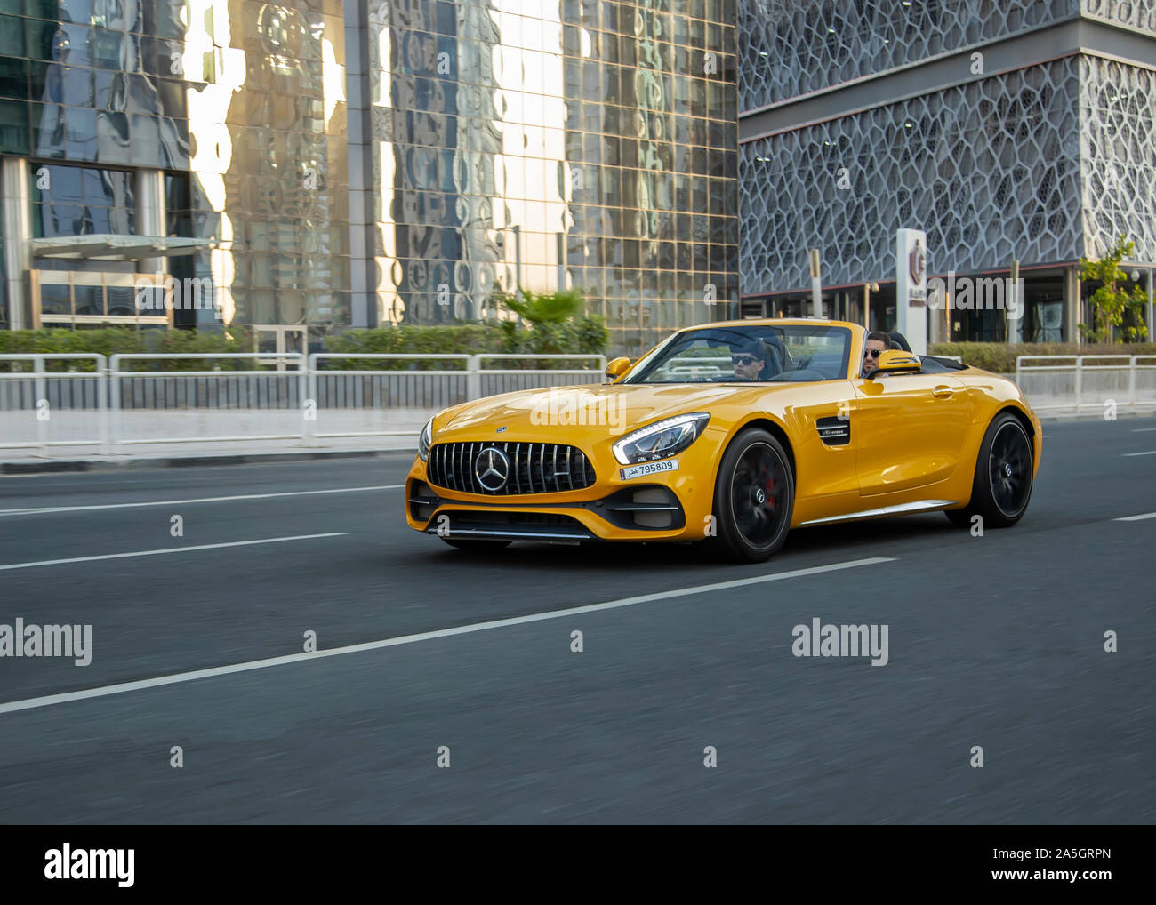 Yellow luxury Mercedes Benz AMG Super car on Doha Roads Stock Photo - Alamy