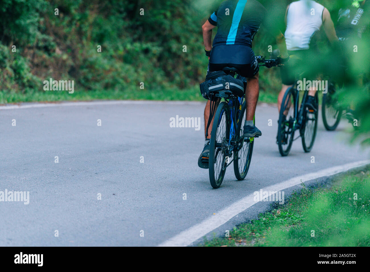 Group of cyclist rides as fast as they can while competing on a cycling ...