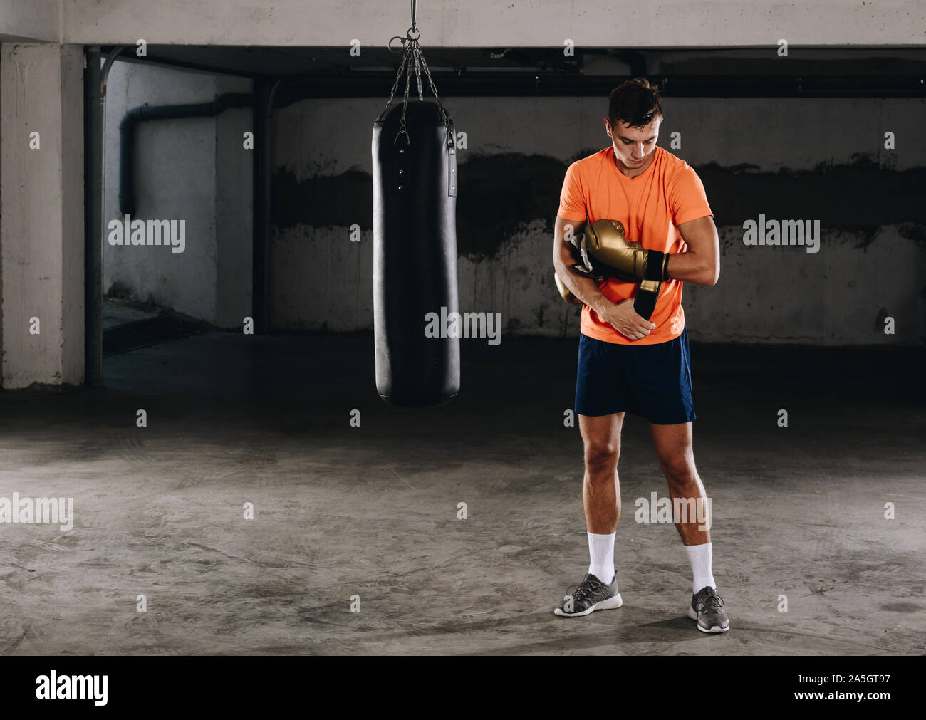 Professional boxer training at gym, practicing kicks and punches Stock ...