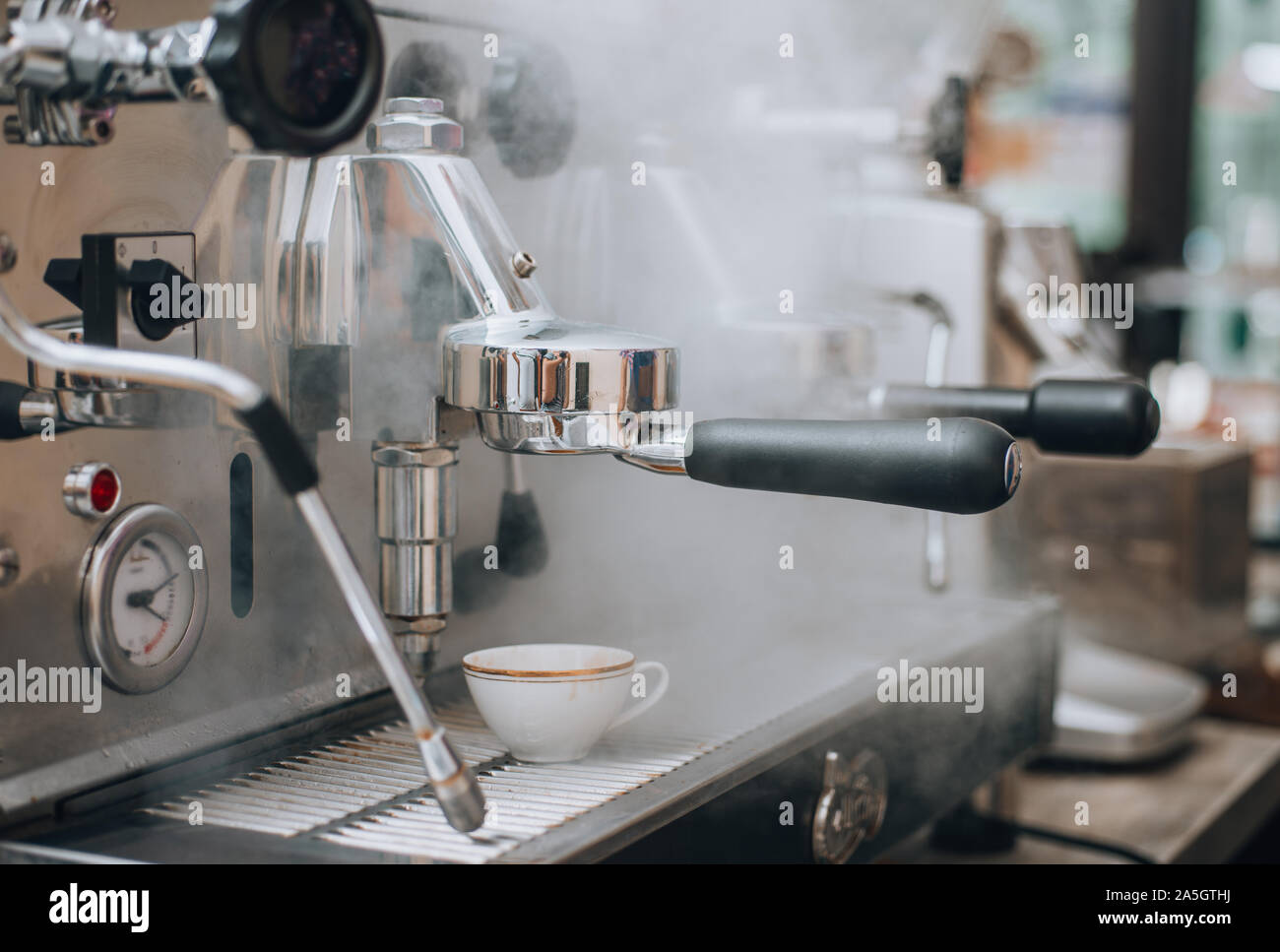 Professional coffee machine with white cup and pouring drink Stock ...