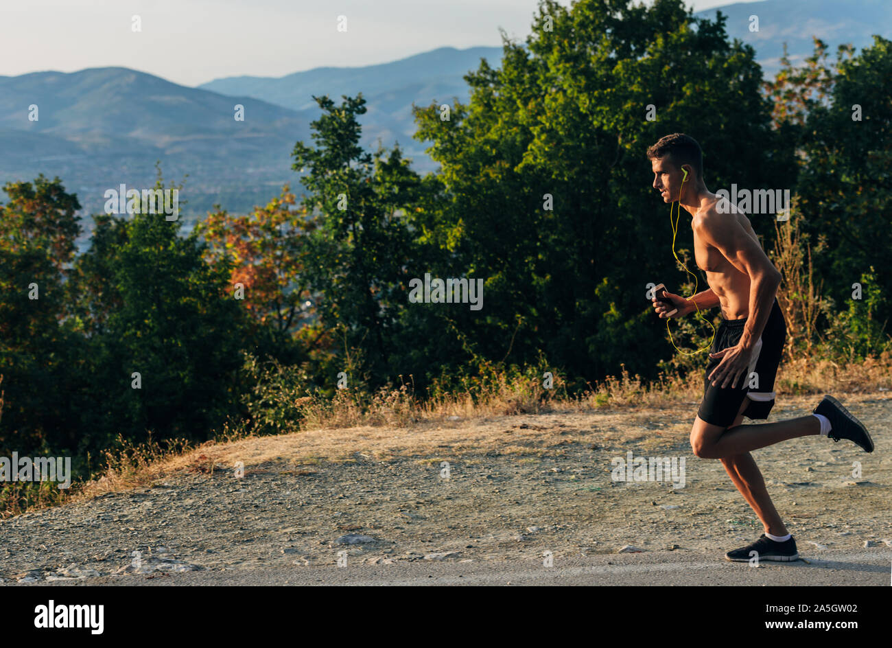 Runner Man running with concentration, determination and strength ...