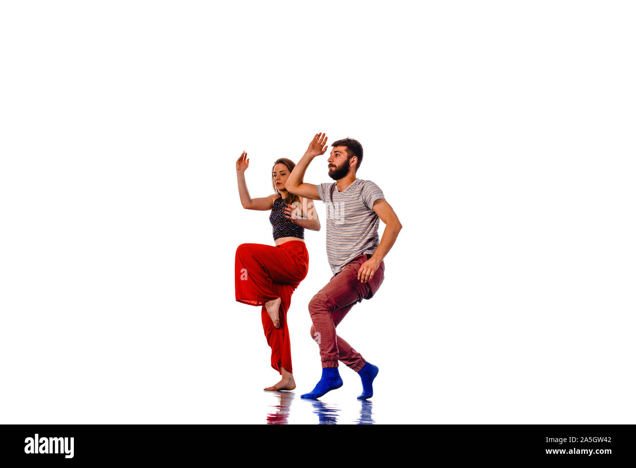 Skillful ballet dancers in movement. Young couple of modern dance ...