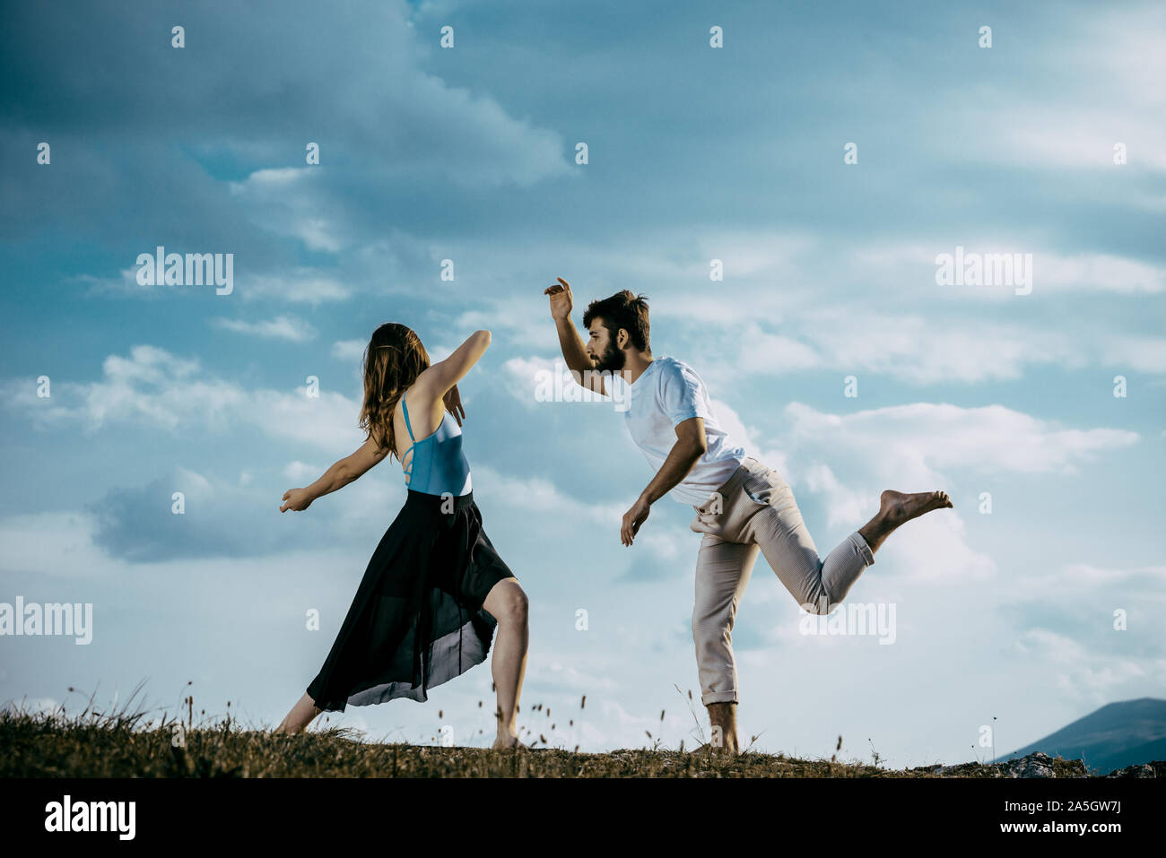 The two young modern ballet dancers training dance routine at the ...