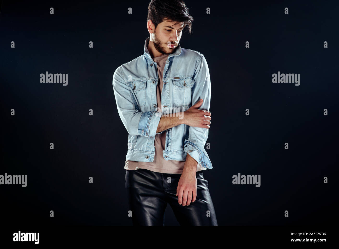 Closeup shot of attractive young male in blue jacket in studio Stock ...