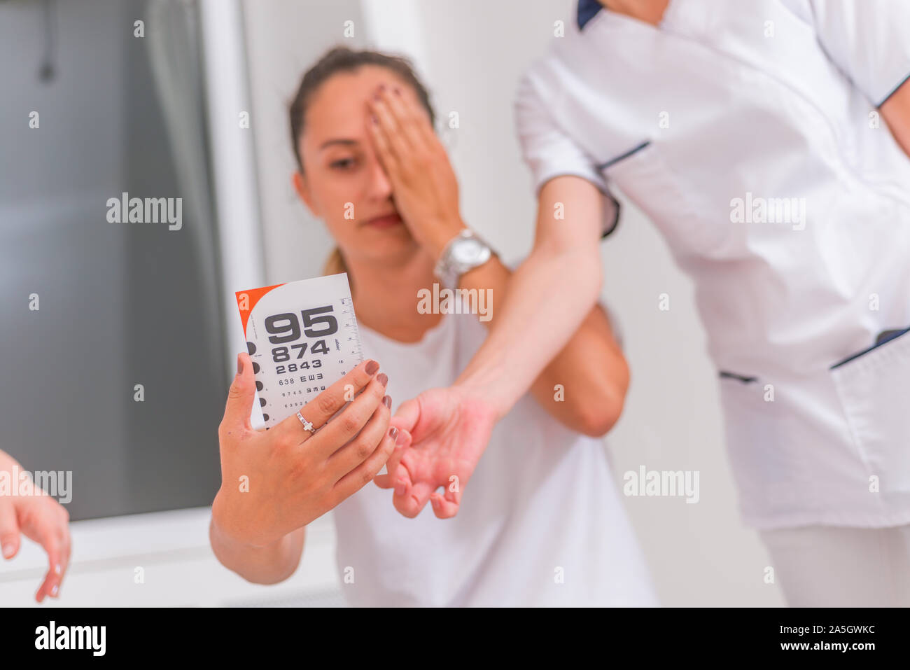 Woman ( girl )reviewing eyesight closing eye with hand. Eye test ... Woman ( girl )reviewing eyesight closing eye with hand. Eye test ...