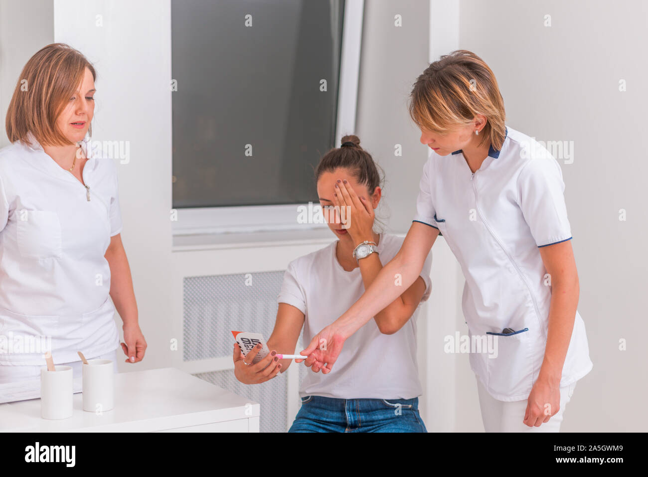 Woman ( girl )reviewing eyesight closing eye with hand. Eye test ...