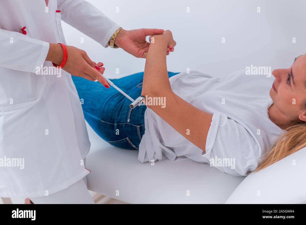 Close up photo of a reflexes examination on a teenage girl Stock Photo ...