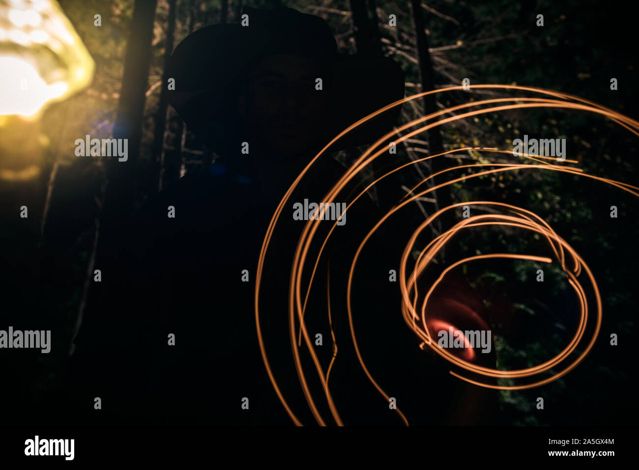 Fantasy wizard making magical circle speells with his pendulum in the ...