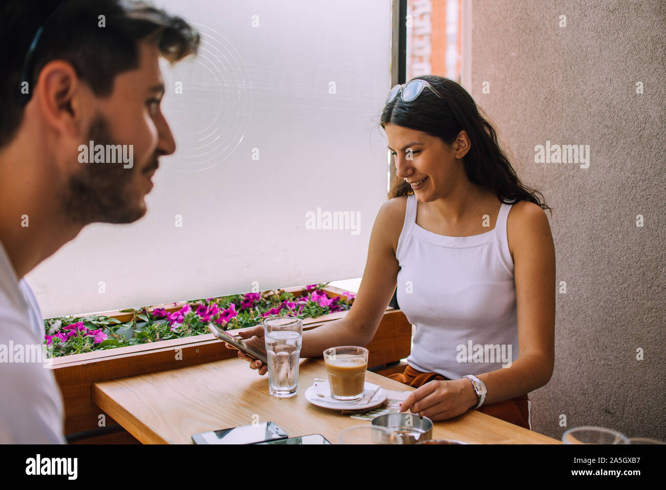 Fashionable young urban couple going out on a date in coffee restaurant ...
