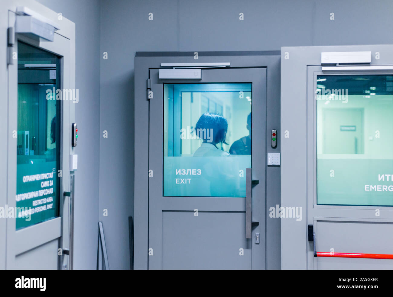Security personnel exiting secured exit door with access control number ...