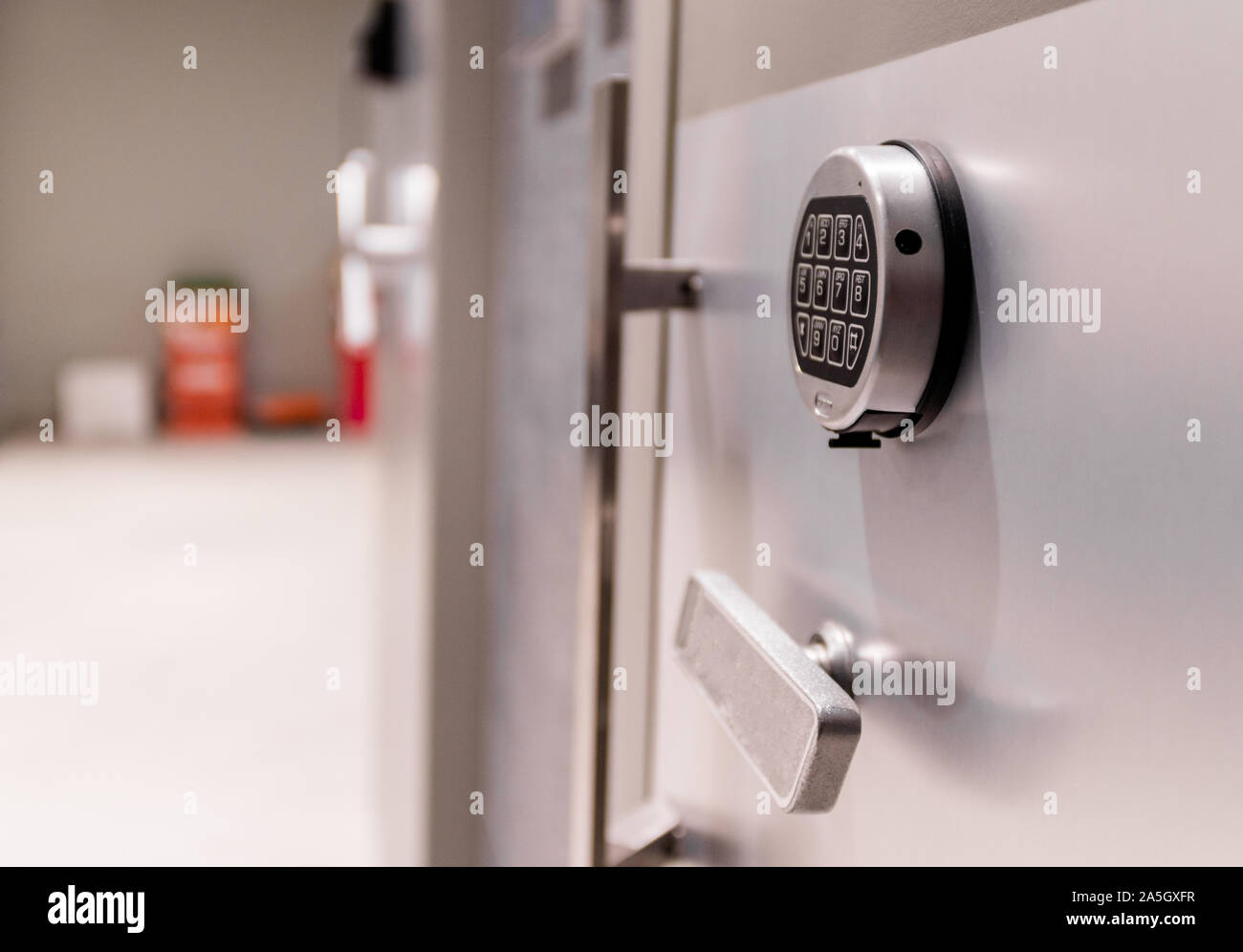 Large metal safe door with numeric keypad and handle for opening Stock Photo - Alamy