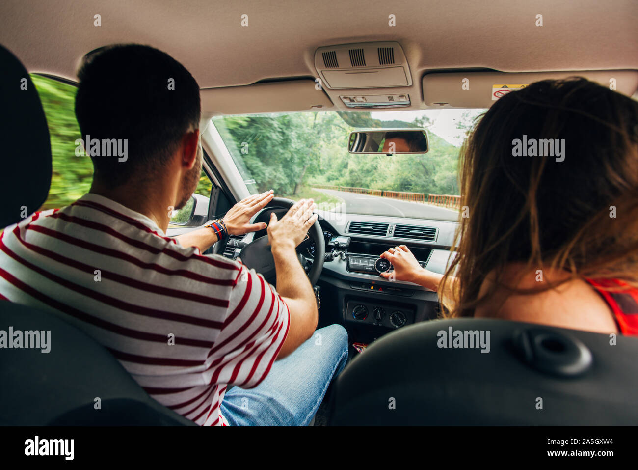 Romantic couple having roadtrip while man driving his car Stock Photo ...