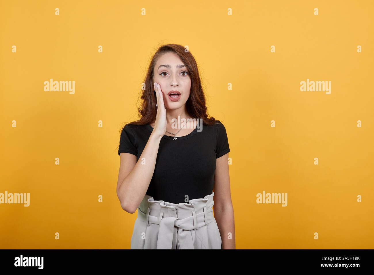 Gorgeous girl screaming someone's name loud and clear Stock Photo - Alamy