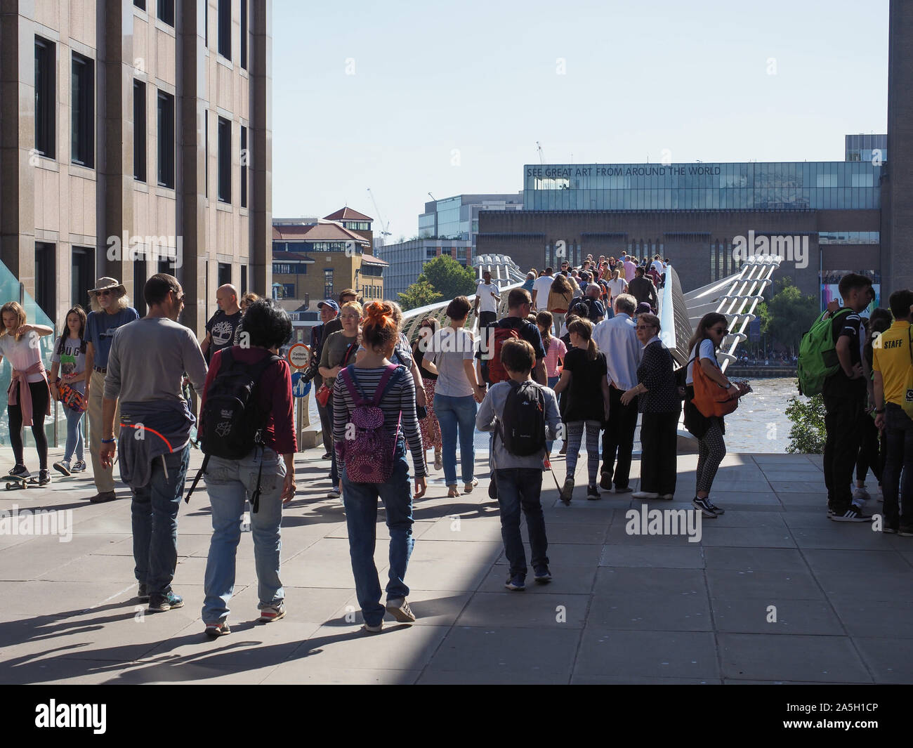 LONDON, UK - CIRCA SEPTEMBER 2019: People crossing Millennium Bridge ...