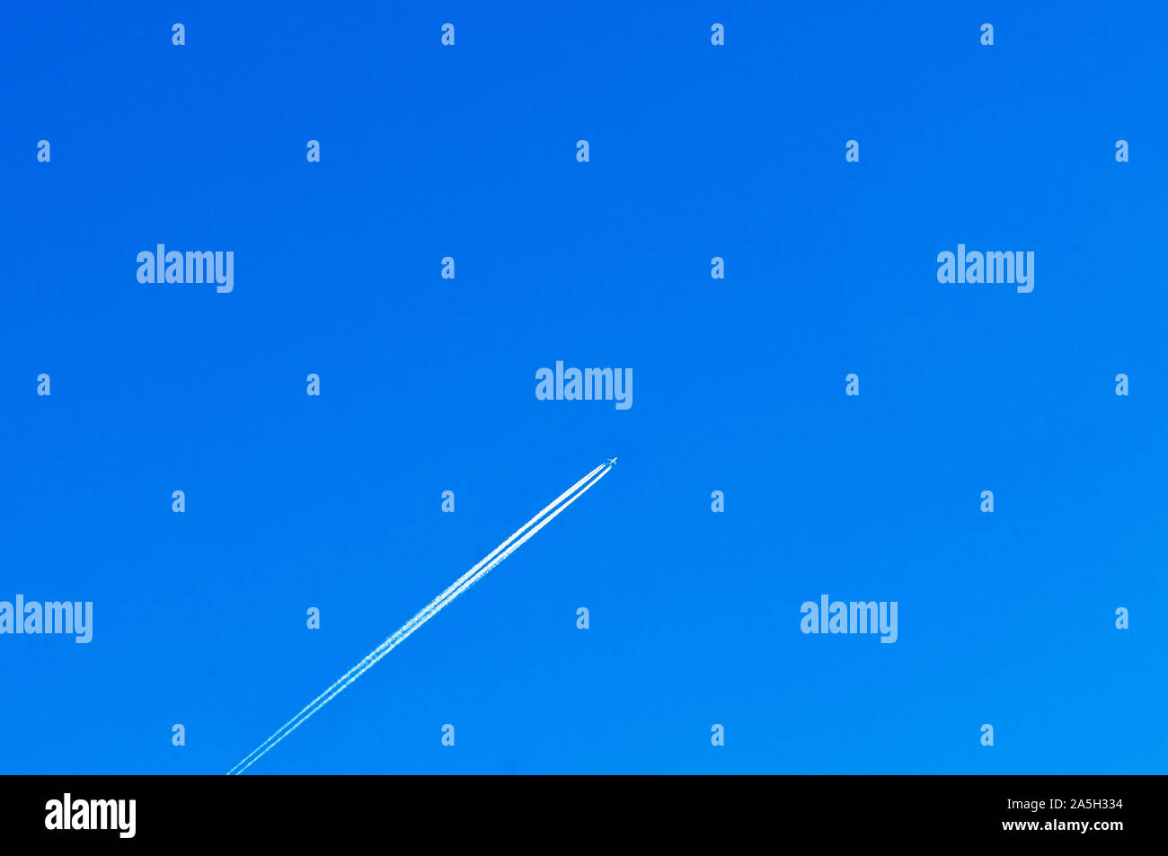 Airplane white smoke contrail tail at high speed cuising at high speed ...