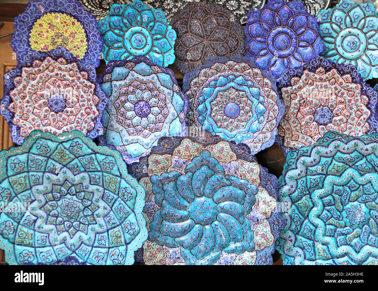 Traditional Iranian souvenirs - copper plates and dishes with floral ...