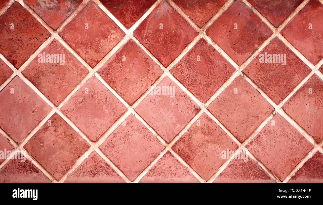 Old porcelain tiles floor texture with tiles of red color and cement of ...