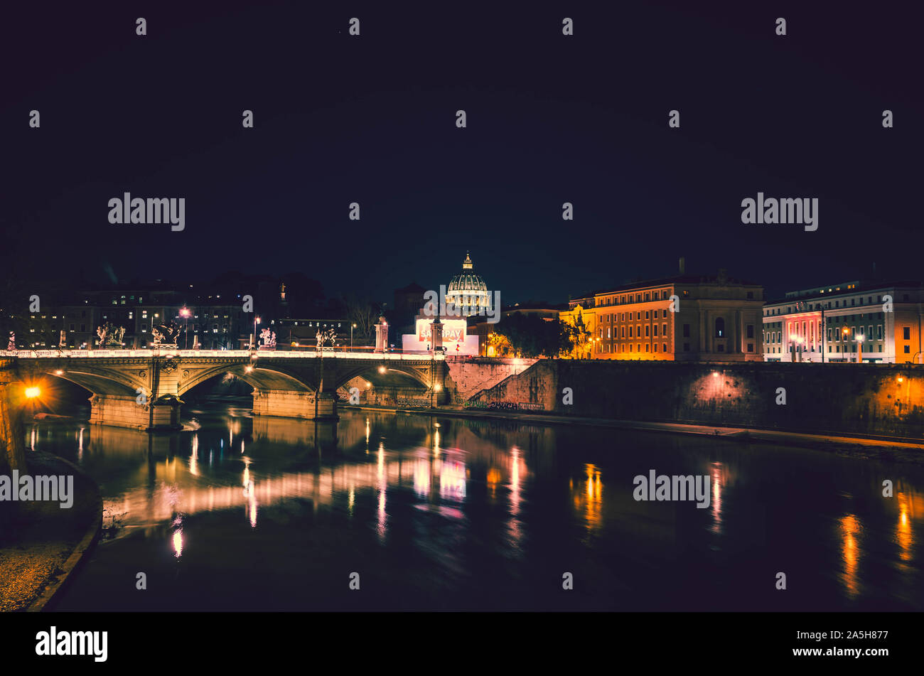 Night view of the Rome.In foreground the Tiber river and its amazing ...