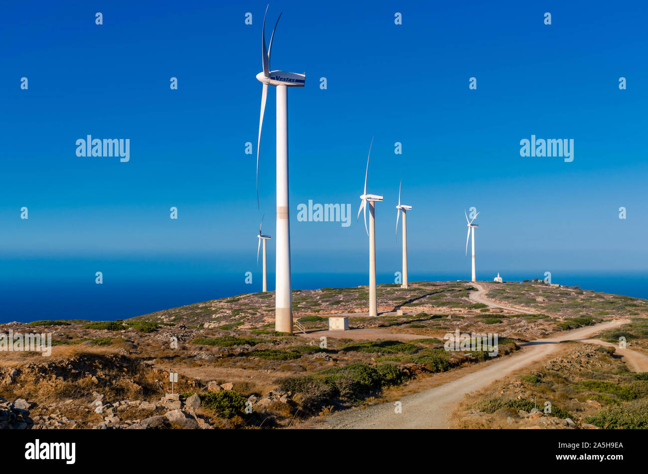 Wind turbine power generator farm on a hillside Stock Photo - Alamy