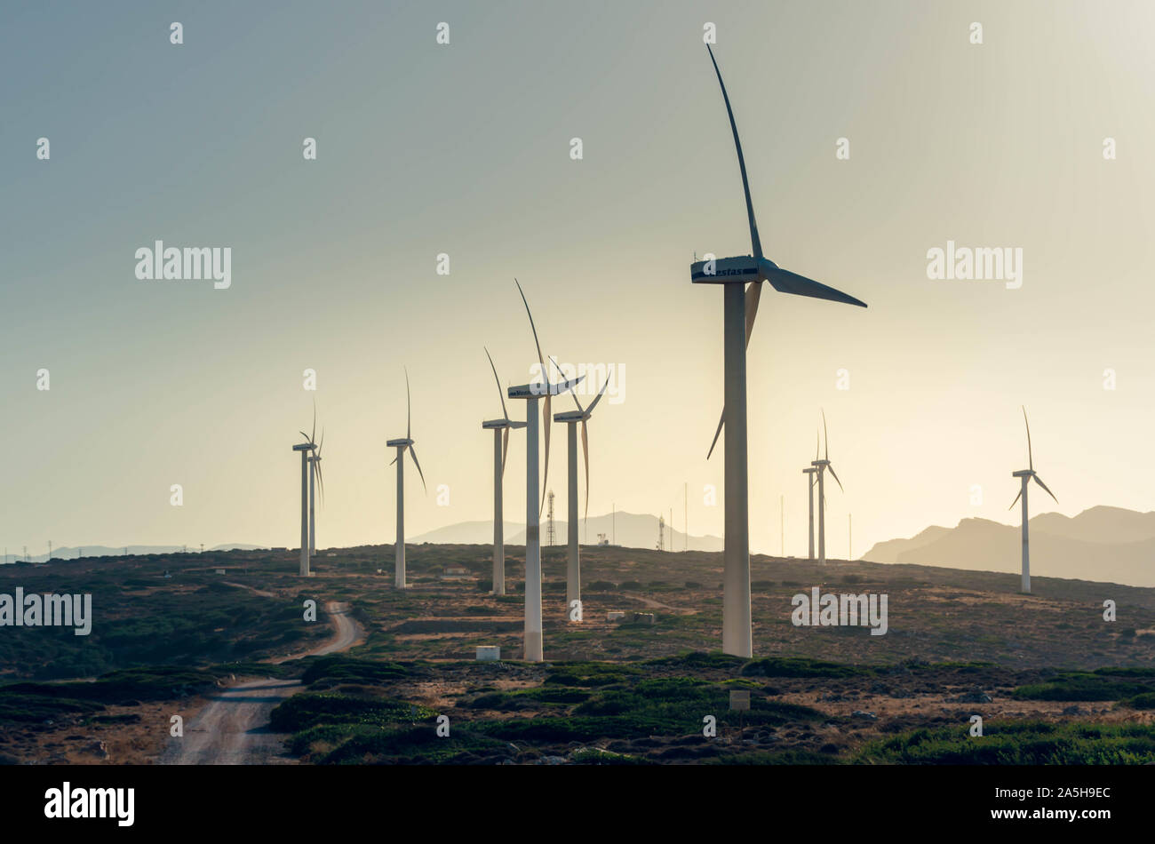 Wind turbine power generator farm on a hillside Stock Photo - Alamy