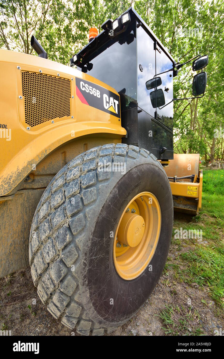 Massive yellow CAT road roller detail of inflatable driving wheel Stock ...