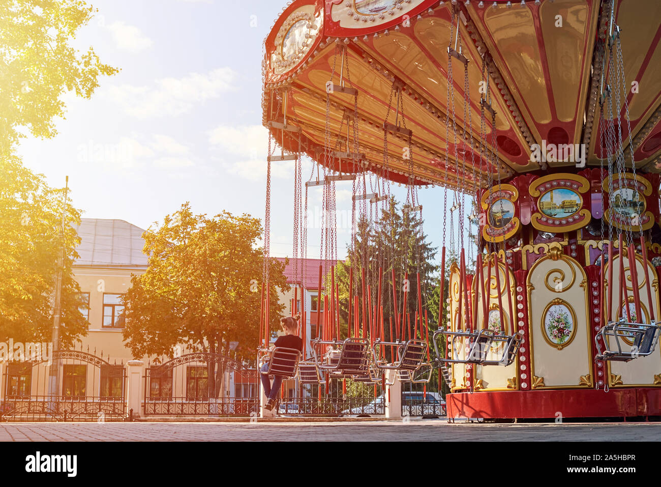 Chain carousel merry-go-round in amusement park Stock Photo - Alamy
