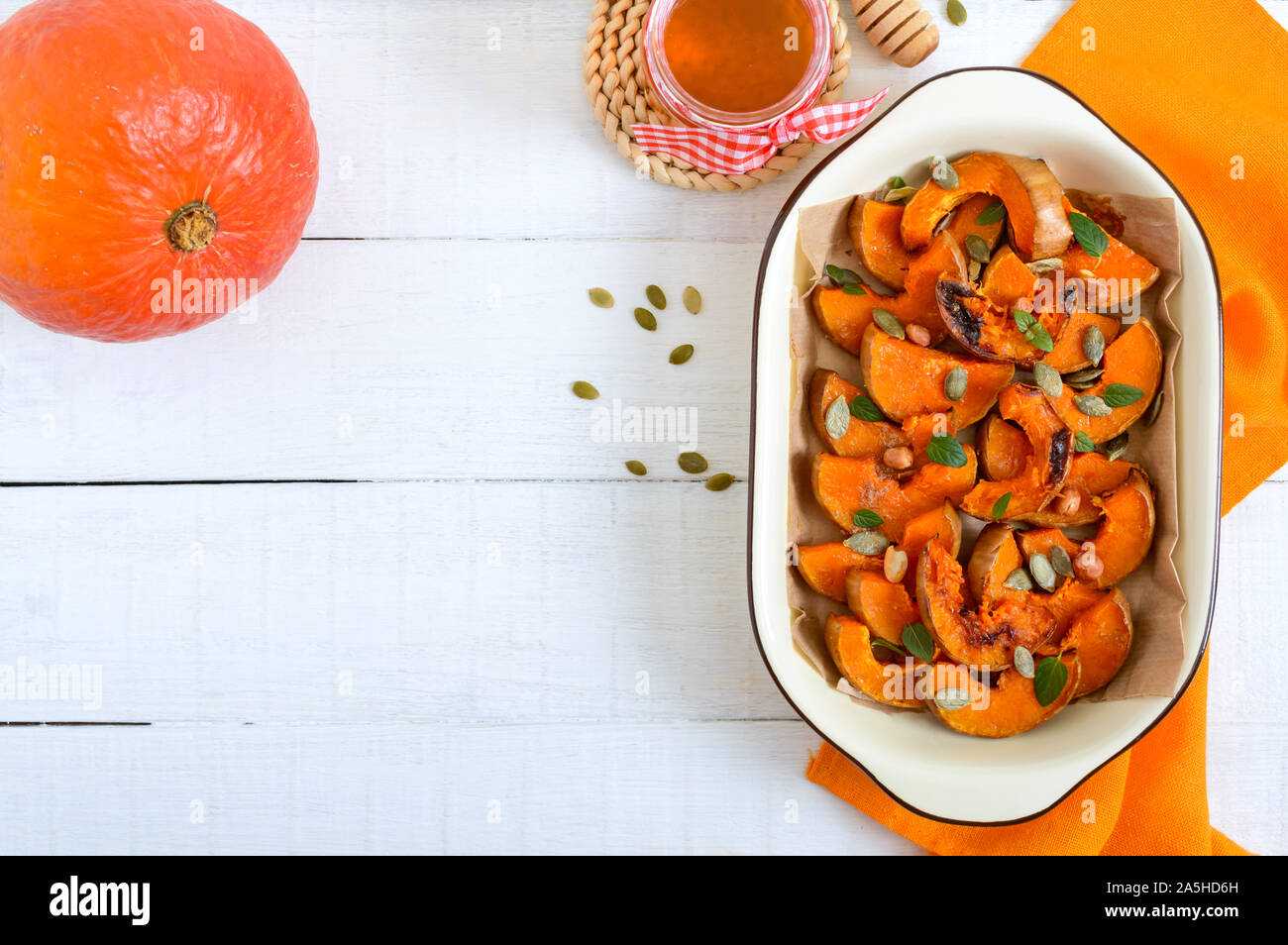 Pumpkin slices baked in the oven with honey, nuts, cinnamon, seeds ...