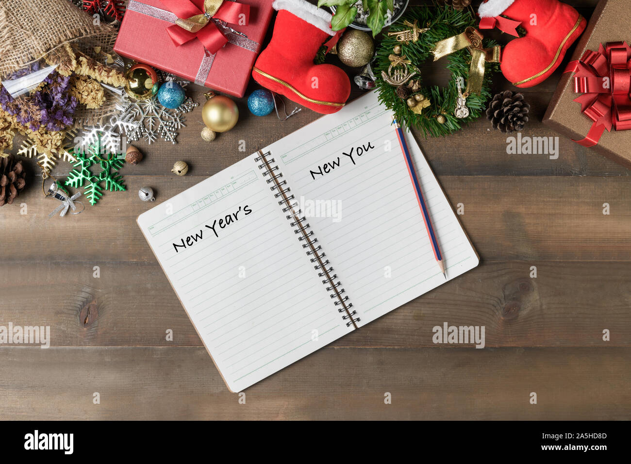New year's new you text on note paper with decorations and gift boxes ...