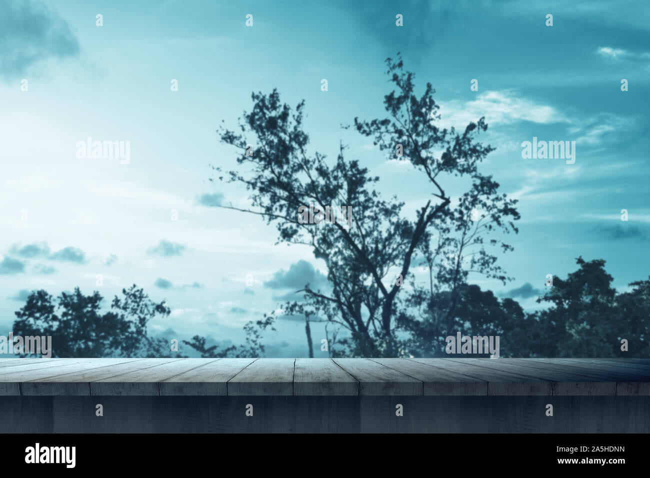 Wooden table with a night scene background Stock Photo - Alamy