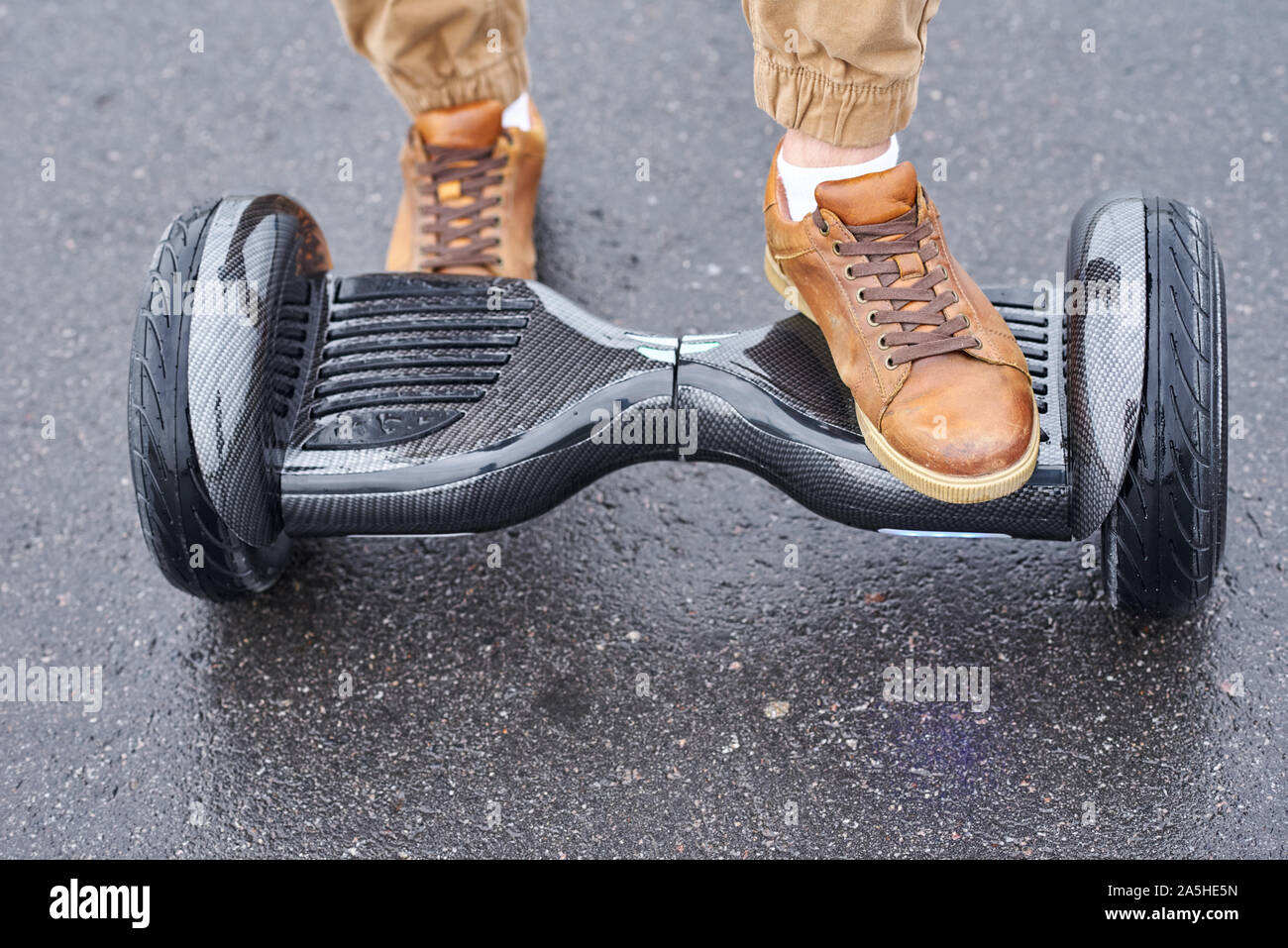 Balancing on board with feet hi-res stock photography and images - Alamy