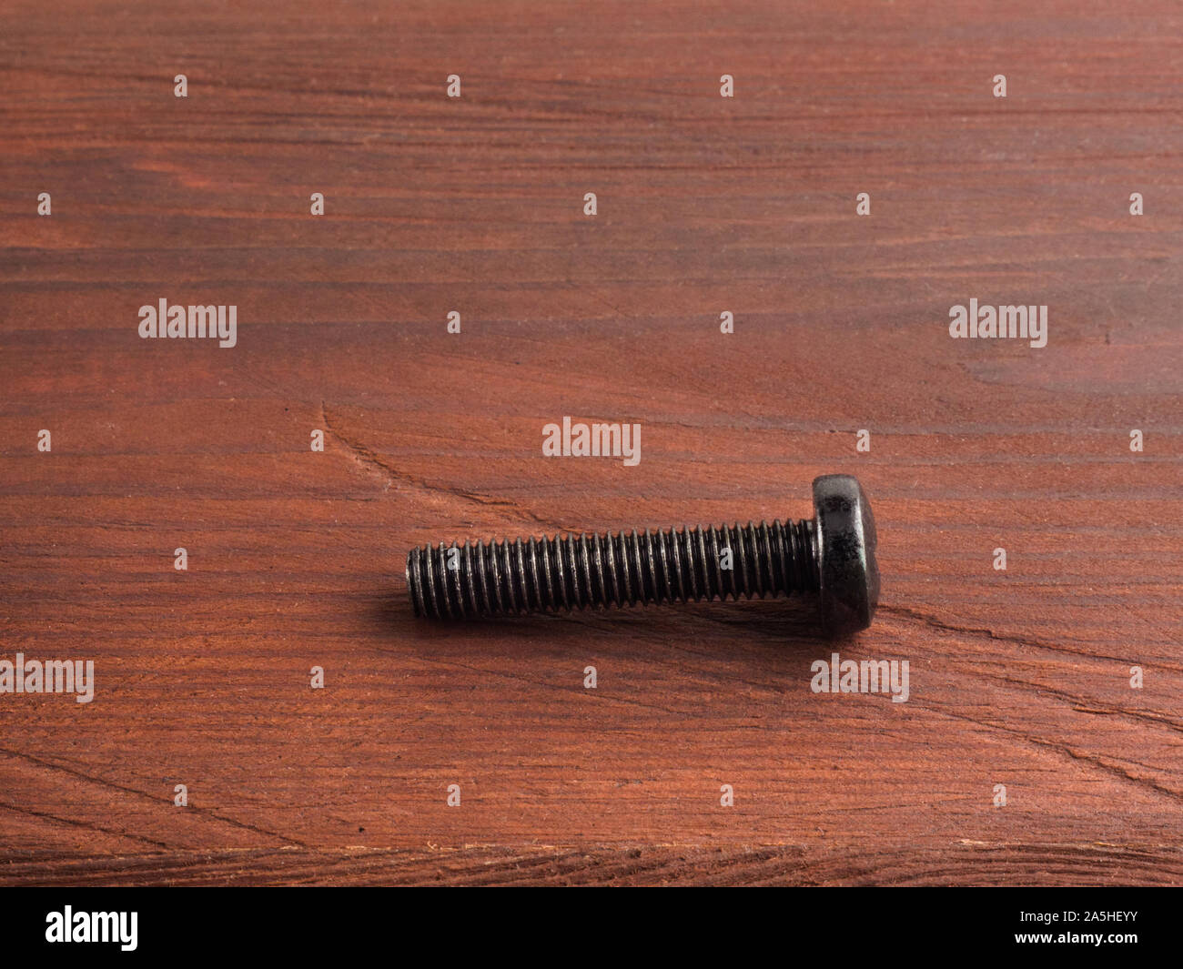 Screw on a brown background with copy space. Industrial theme Stock ...