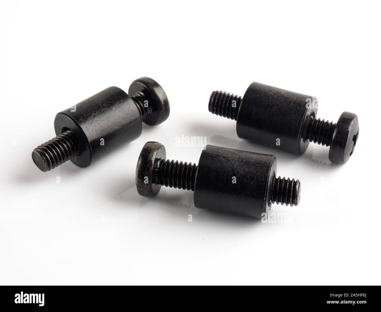 Screws and bushings on a white background Stock Photo - Alamy