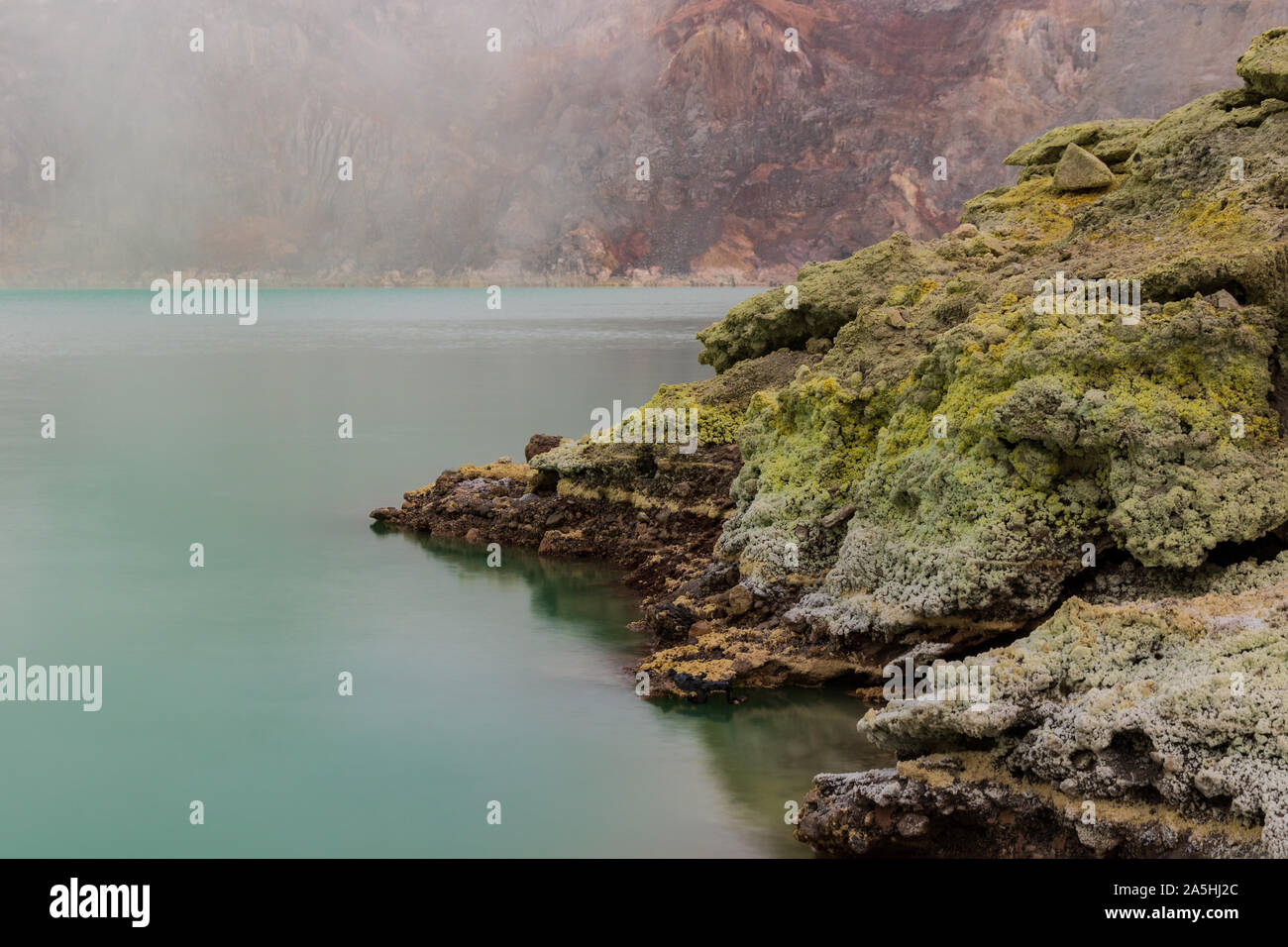 Shore of acid lake inside the crater of Mount Ijen volcano, east Java ...