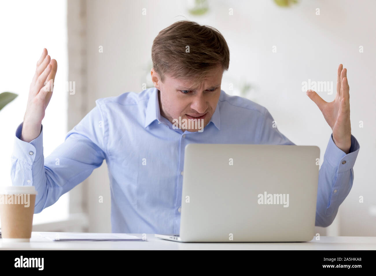 Man middle aged computer outraged hi-res stock photography and images ...