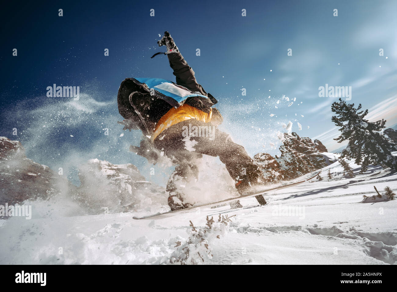 Snowboarder jumps from springboard hi-res stock photography and images ...