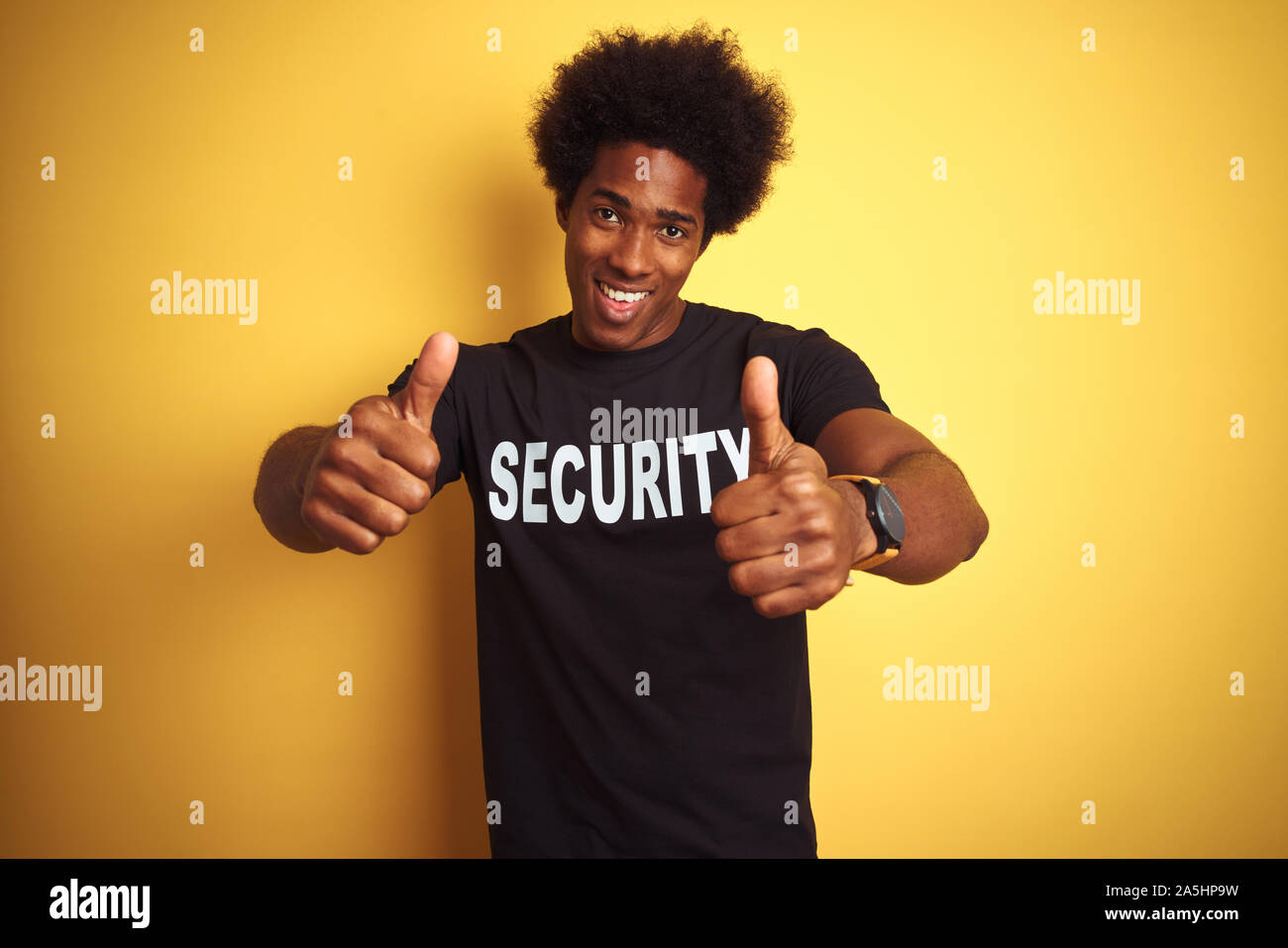American safeguard man with afro hair wearing security uniform over ...
