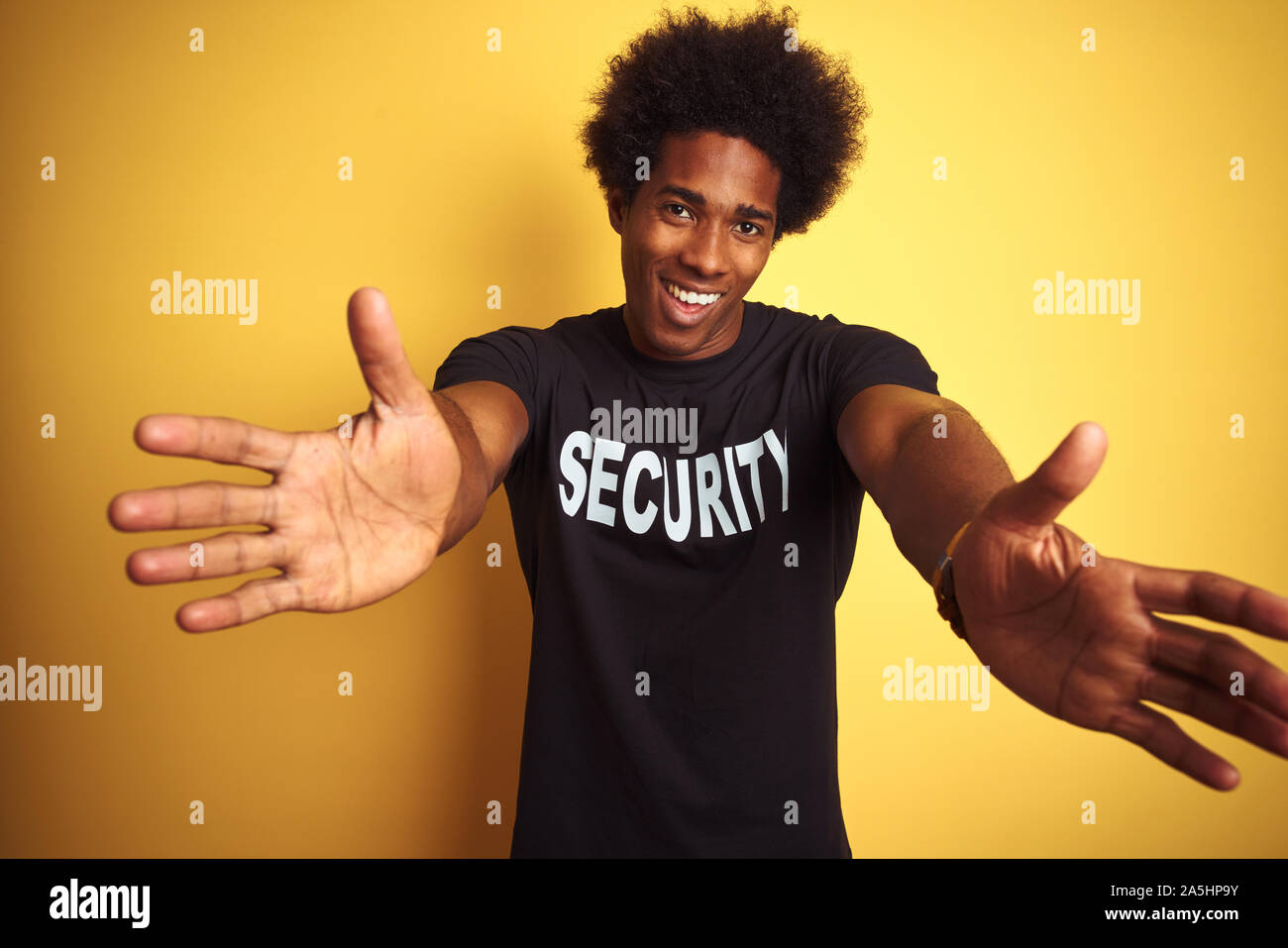 American safeguard man with afro hair wearing security uniform over ...