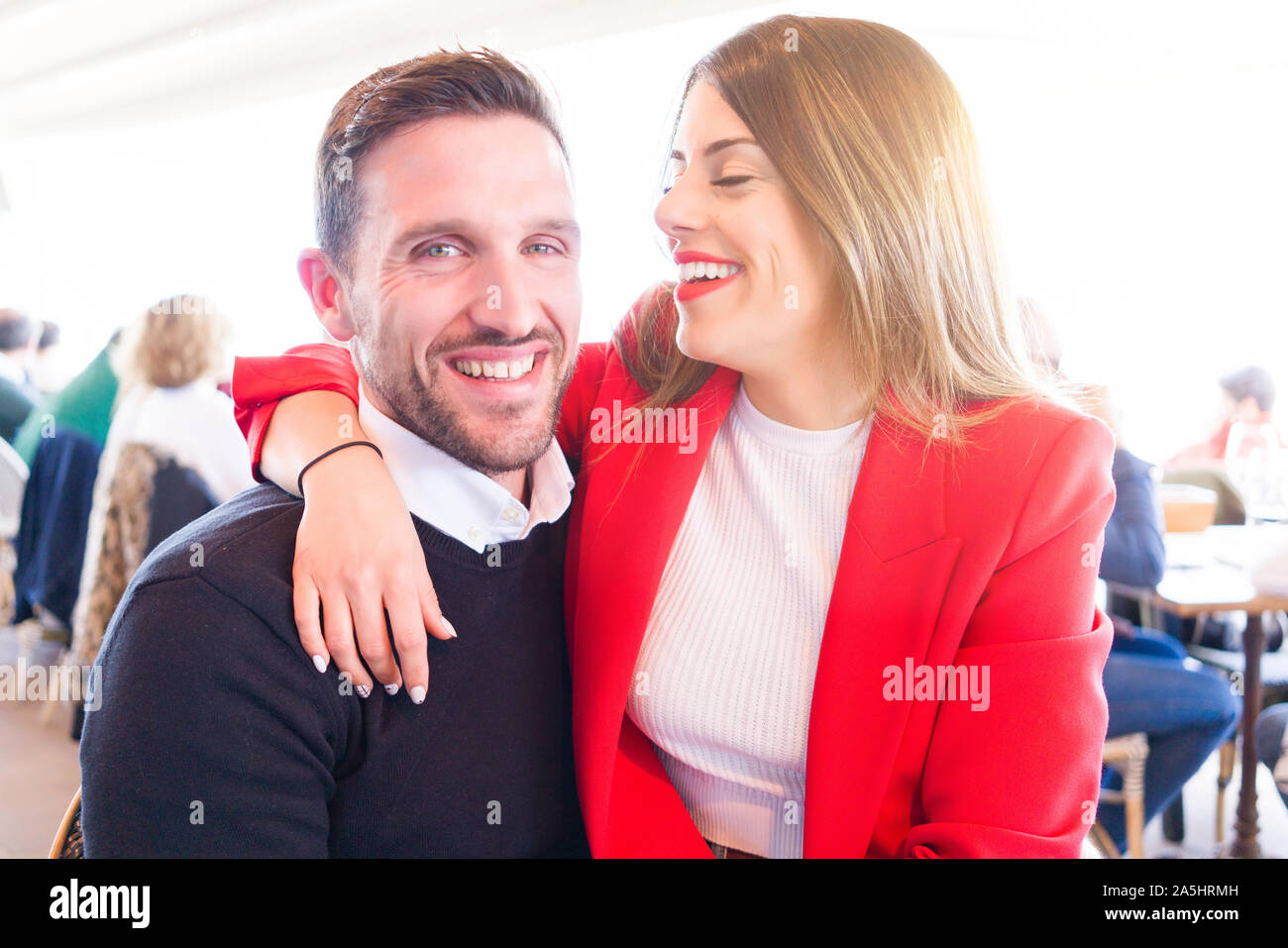 Young beautiful couple in love smiling happy and giving affection to ...
