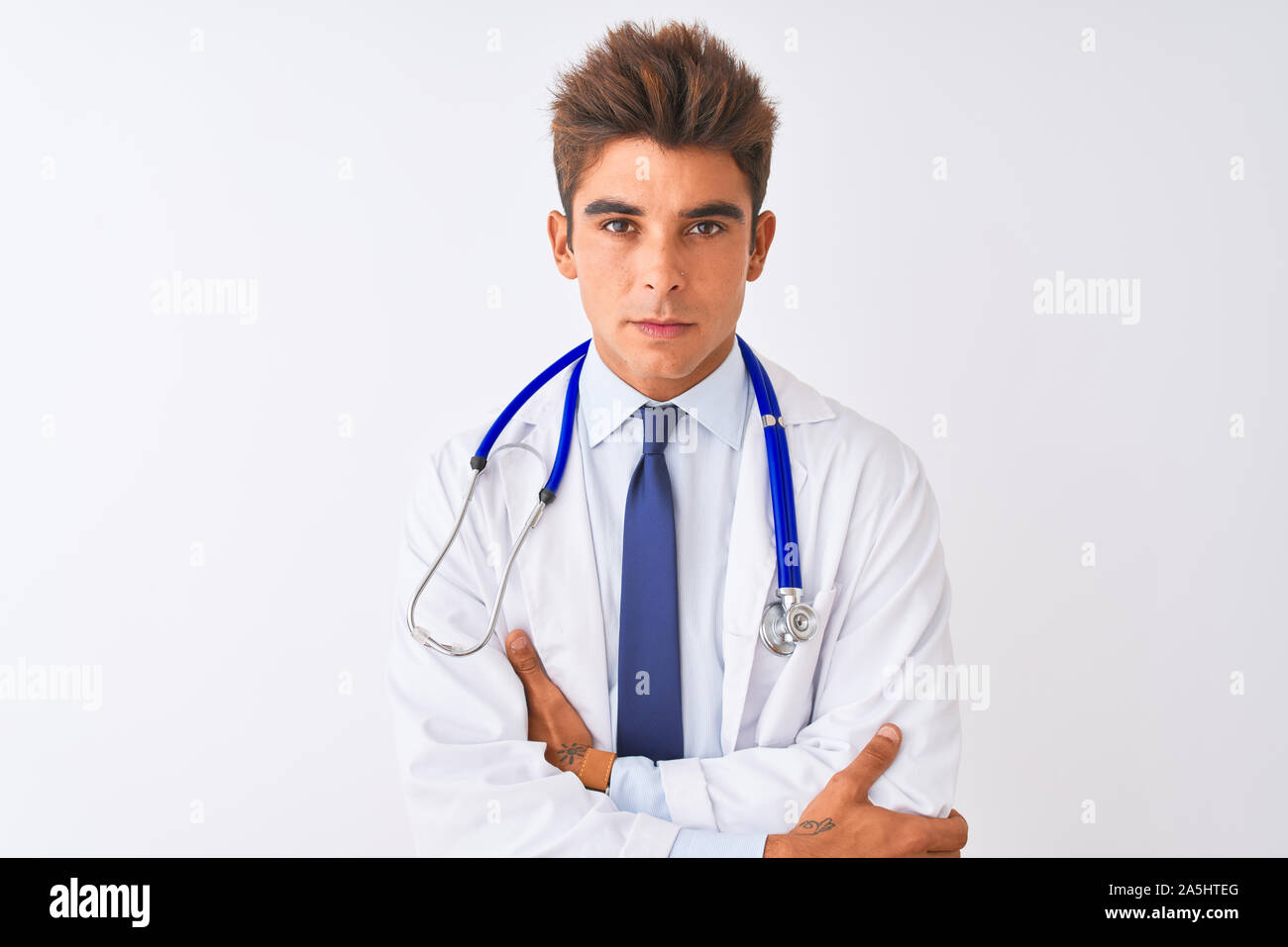 Young handsome doctor man wearing stethoscope over isolated white ...