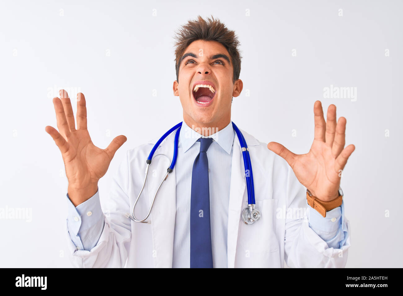 Young handsome doctor man wearing stethoscope over isolated white ...
