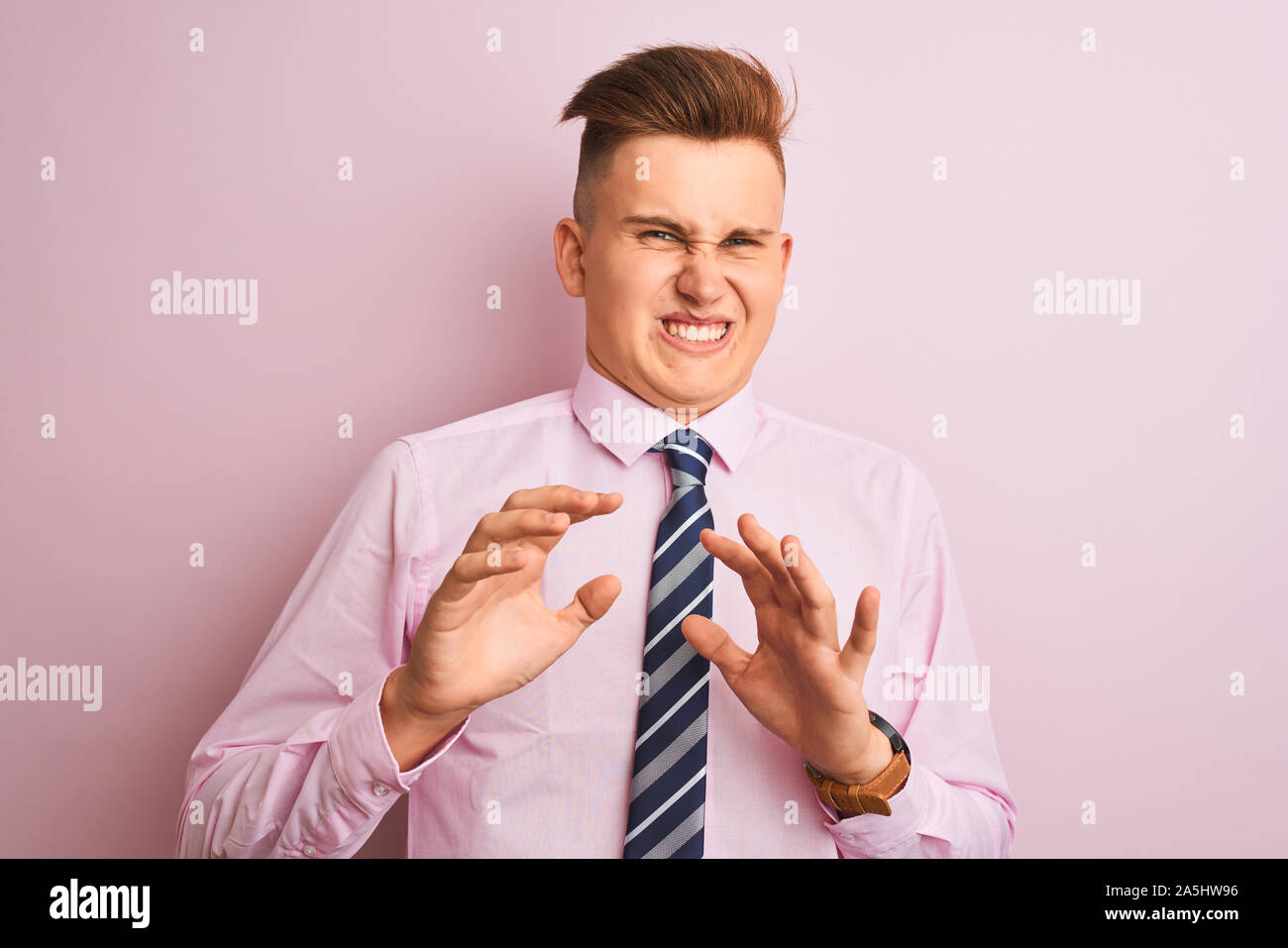 Young handsome businessman wearing shirt and tie standing over isolated ...