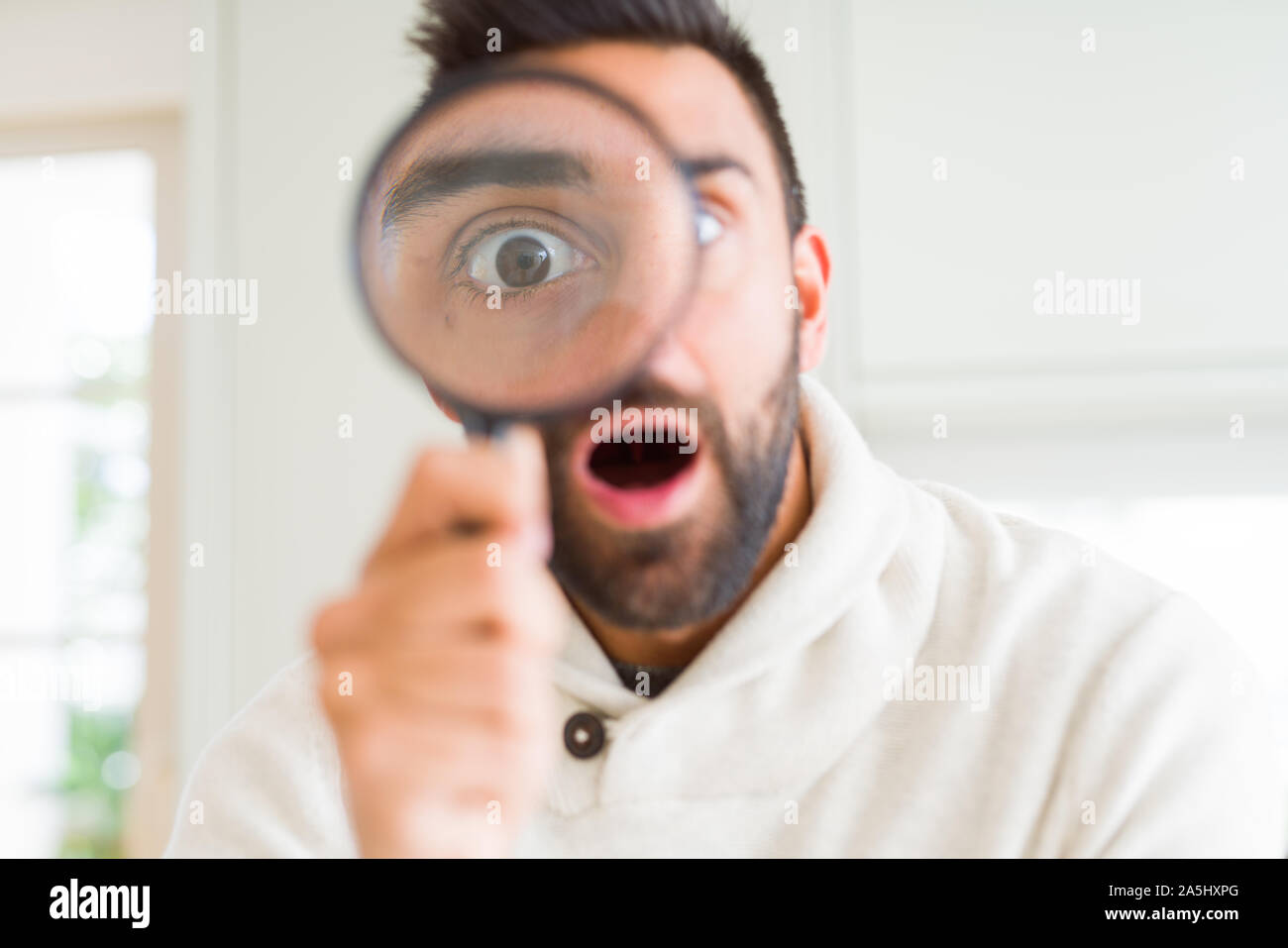 Smiling boy using magnifying hi-res stock photography and images - Alamy