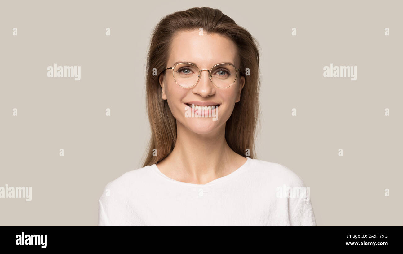 Headshot of smiling millennial girl posing in spectacles Stock Photo ...