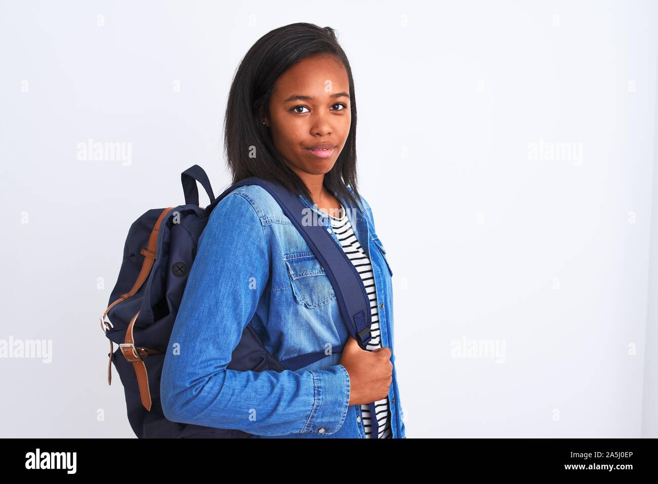 Young african american student woman wearing backpack over isolated ...