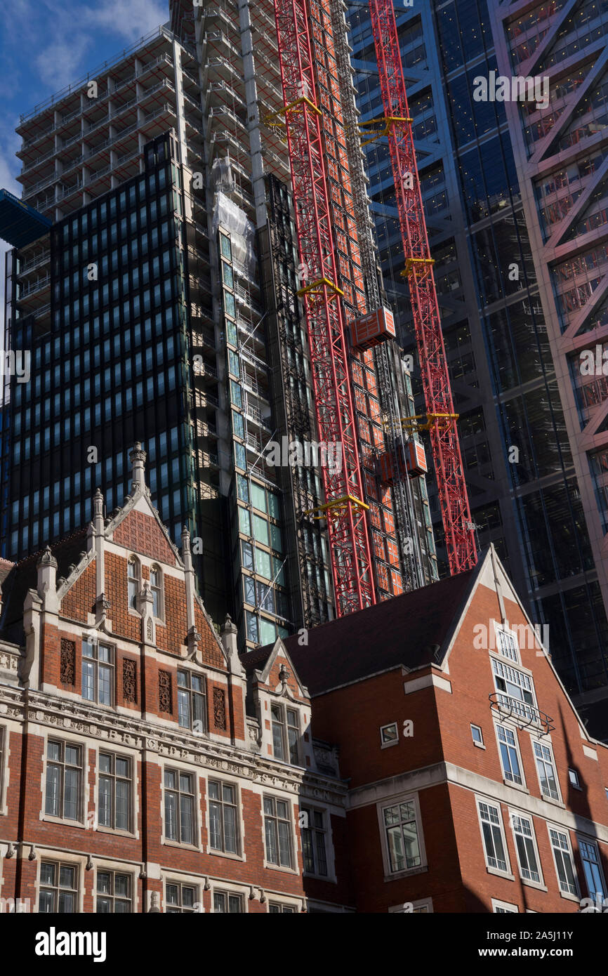 View of new corporate office building construction by old traditional ...