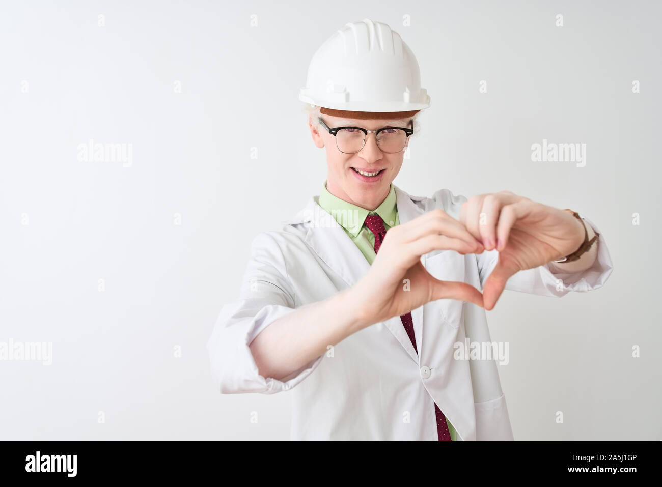 Albino scientist man wearing glasses and helmet standing over isolated ...