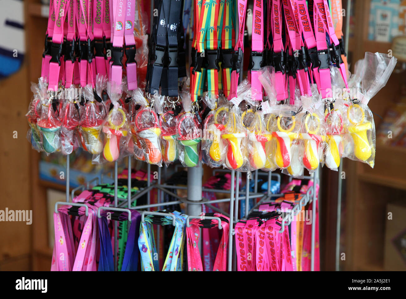 A group of candy rock dummies on ribbons hanging in sweet shop store ...