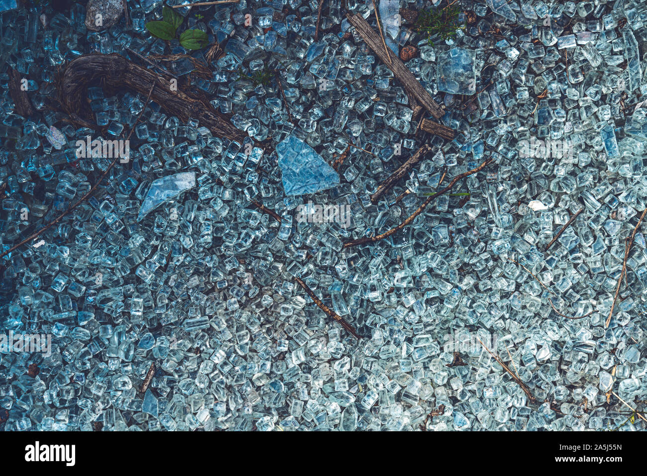 close up of colorful glass shards covering the ground Stock Photo - Alamy